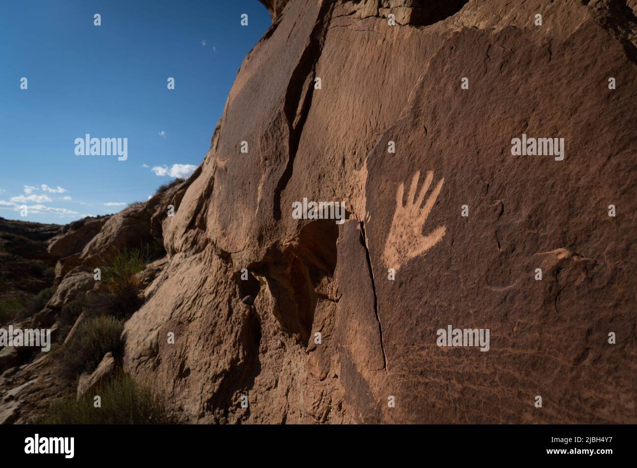 Native American Petroglyphs etched into the steep canyon walls along ...