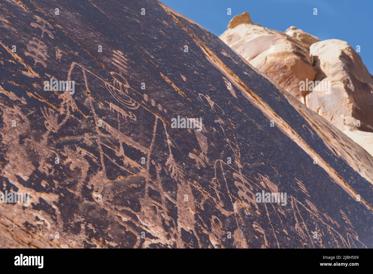 Native American Petroglyphs etched into the steep canyon walls along ...