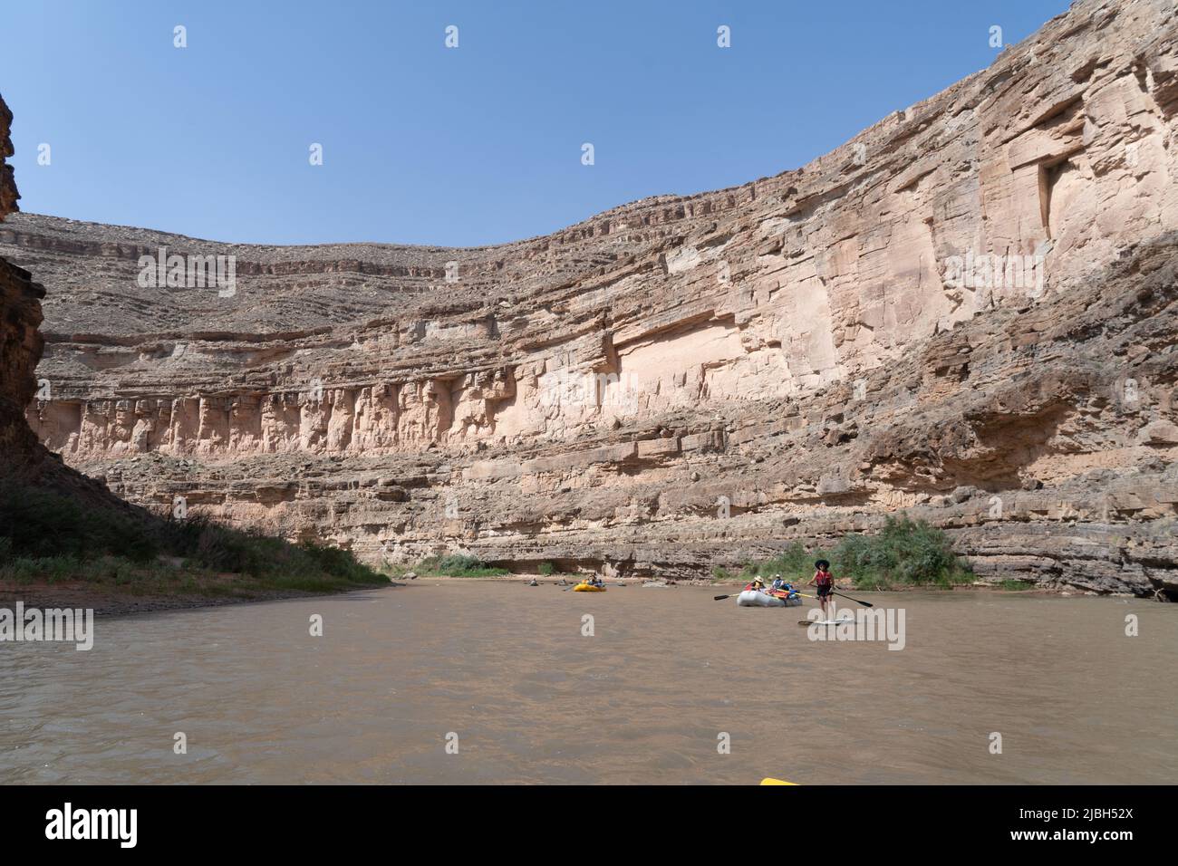 River explorers and tourists navigate their boats, rafts, paddle boards ...