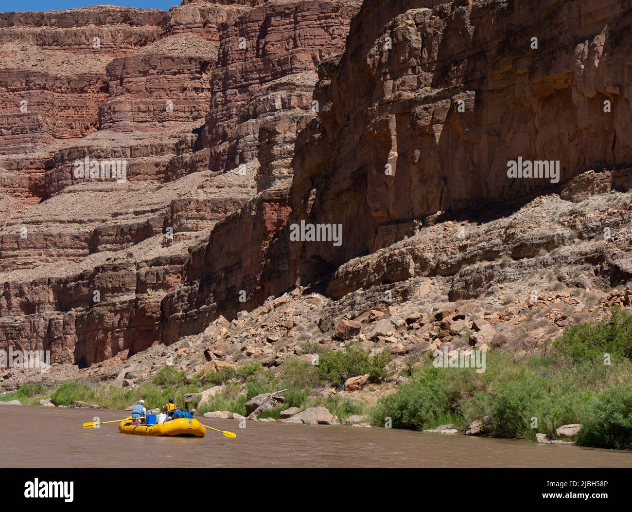 River explorers and tourists navigate their boats, rafts, paddle boards ...