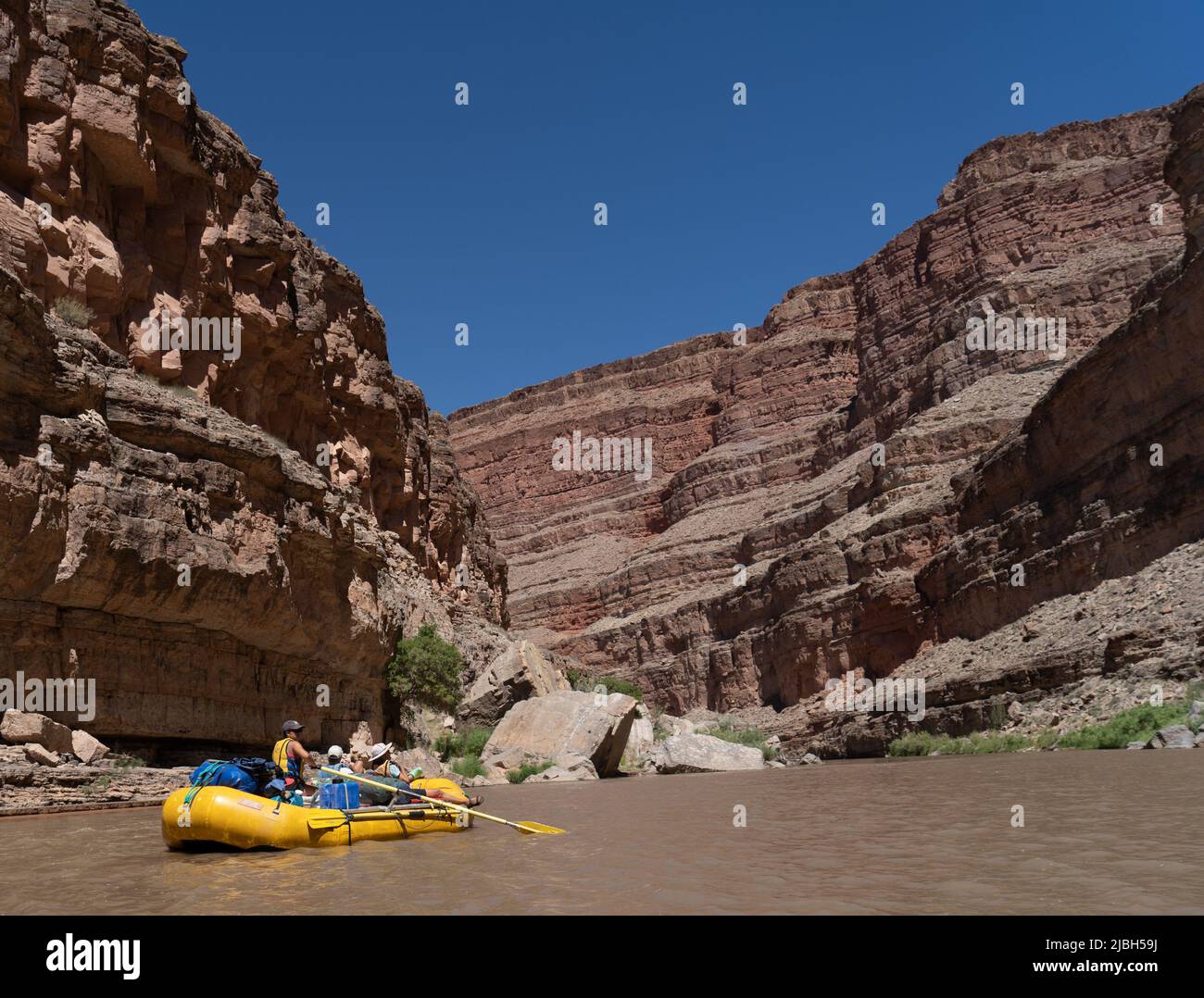 River explorers and tourists navigate their boats, rafts, paddle boards ...