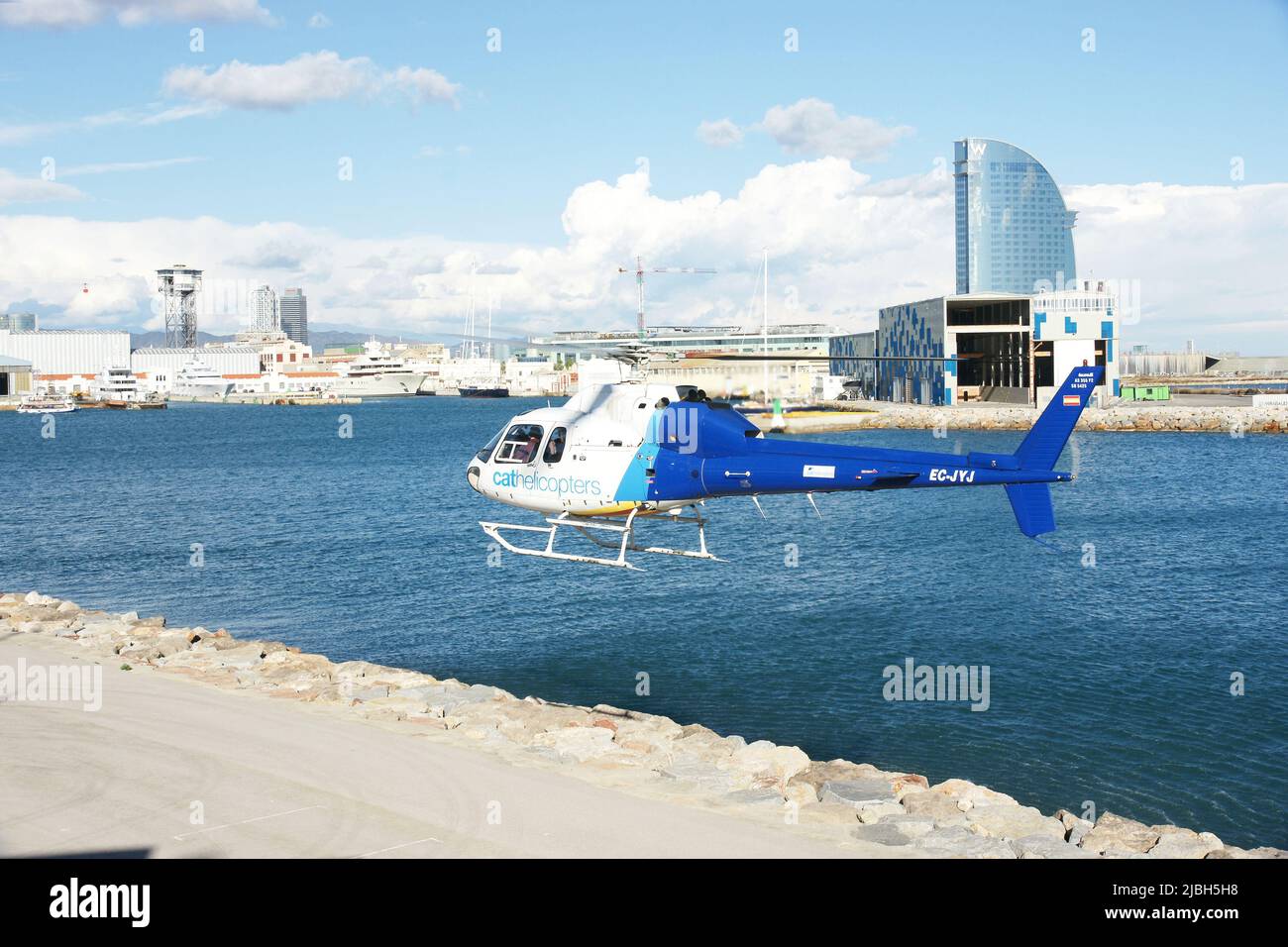 Helicopter soaring in the port of Barcelona, Catalunya, Spain, Europe ...