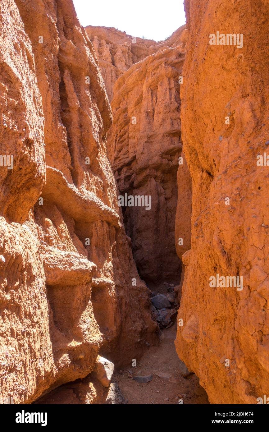 Red rocks and a passage between rocks. Clay canyons. Issyk-Kul region ...