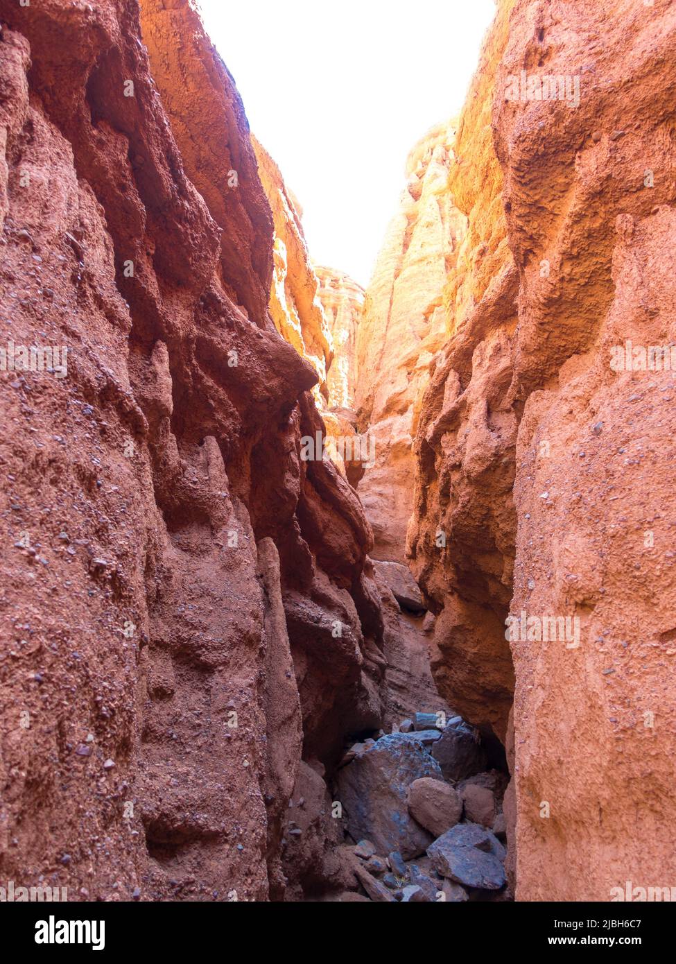 Red rocks and a passage between rocks. Clay canyons. Issyk-Kul region ...
