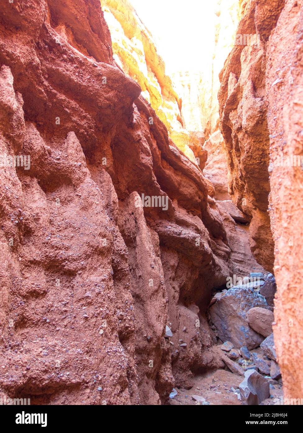Red rocks and a passage between rocks. Clay canyons. Issyk-Kul region ...