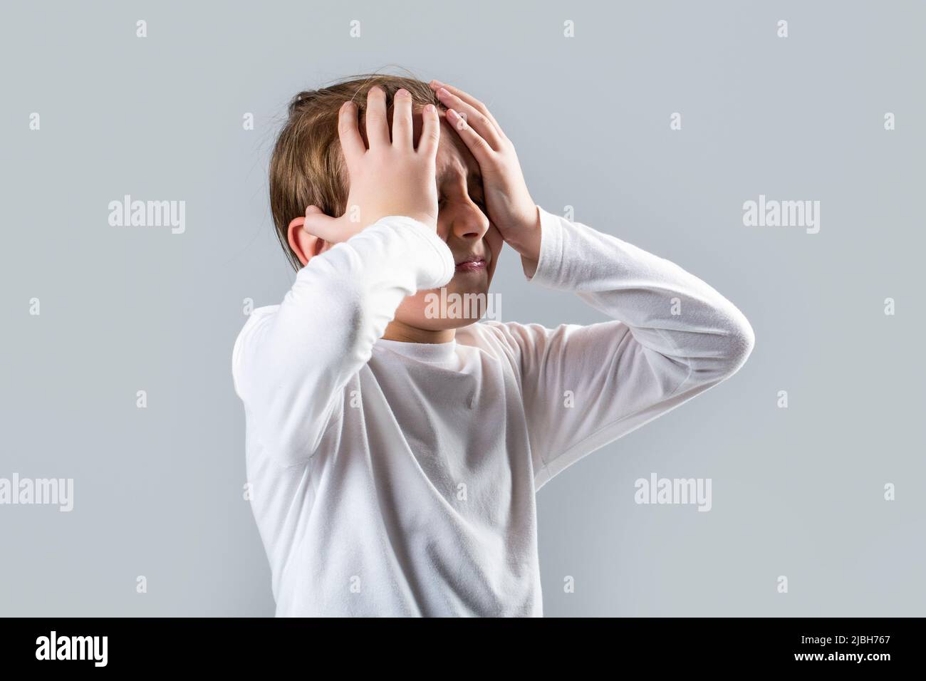 Little boy having a headache. Despair, tragedy. Headache child ...