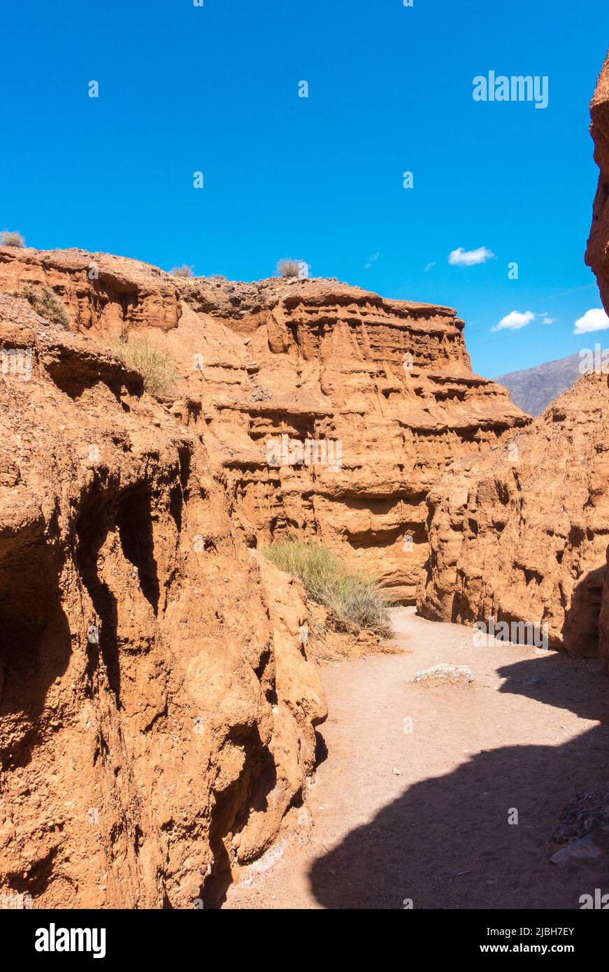 Red rocks and a passage between rocks. Clay canyons. Issyk-Kul region ...