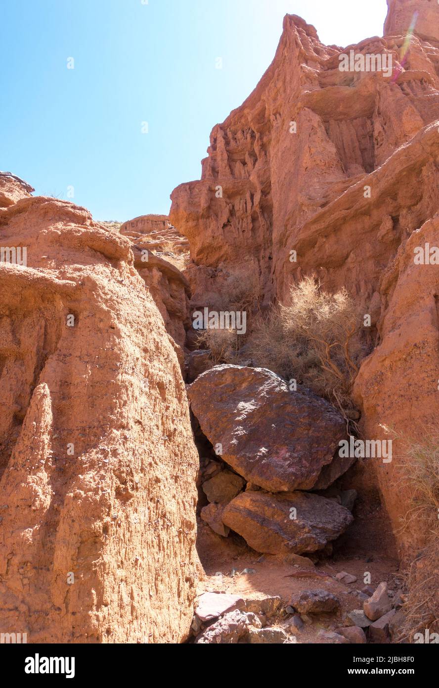 Red rocks and a passage between rocks. Clay canyons. Issyk-Kul region ...