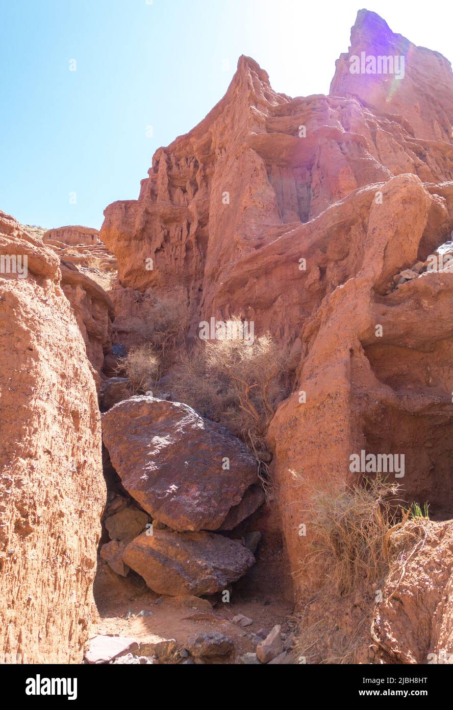 Red rocks and a passage between rocks. Clay canyons. Issyk-Kul region ...