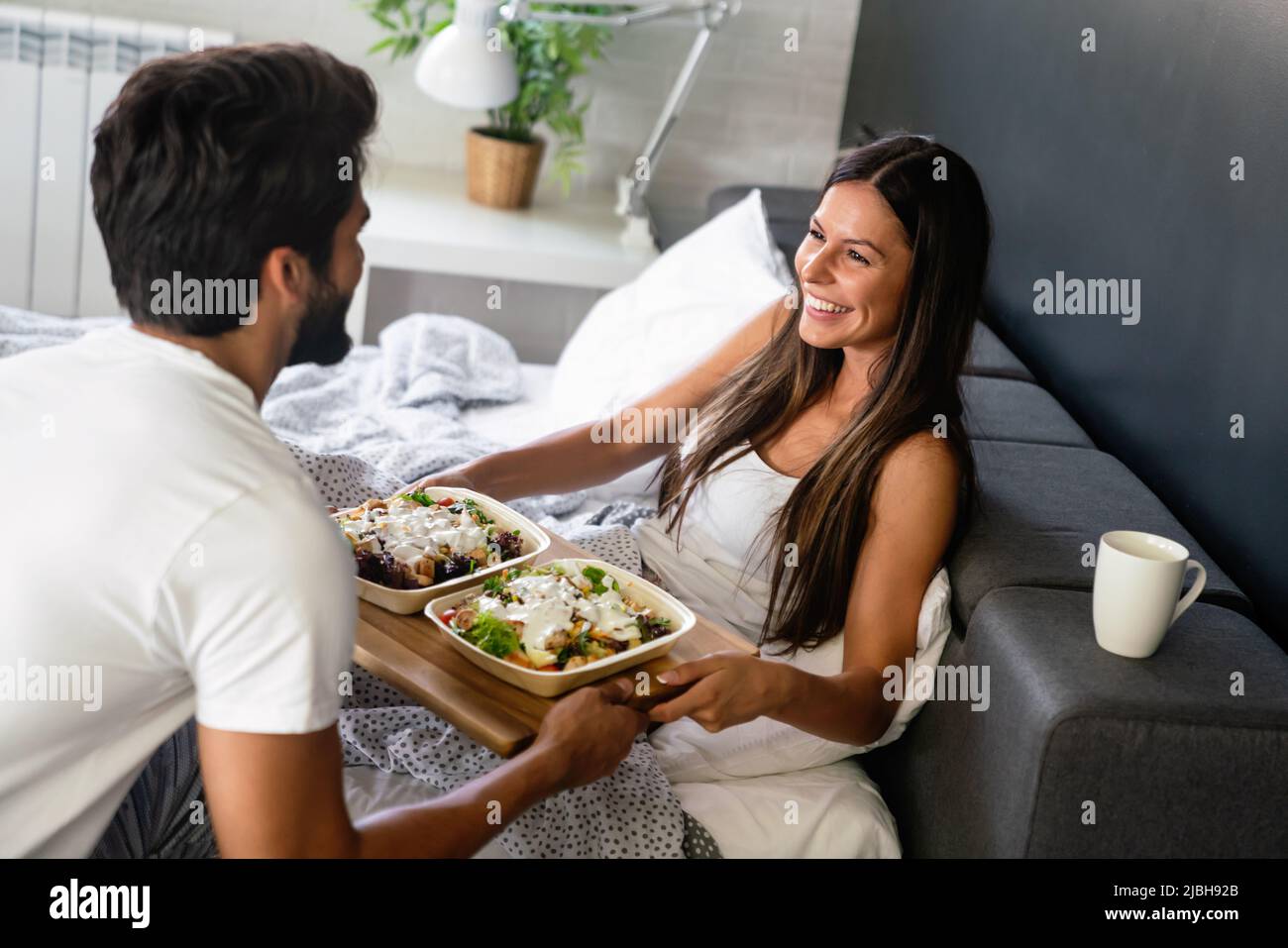 Hand holding breakfast tray hi-res stock photography and images - Alamy