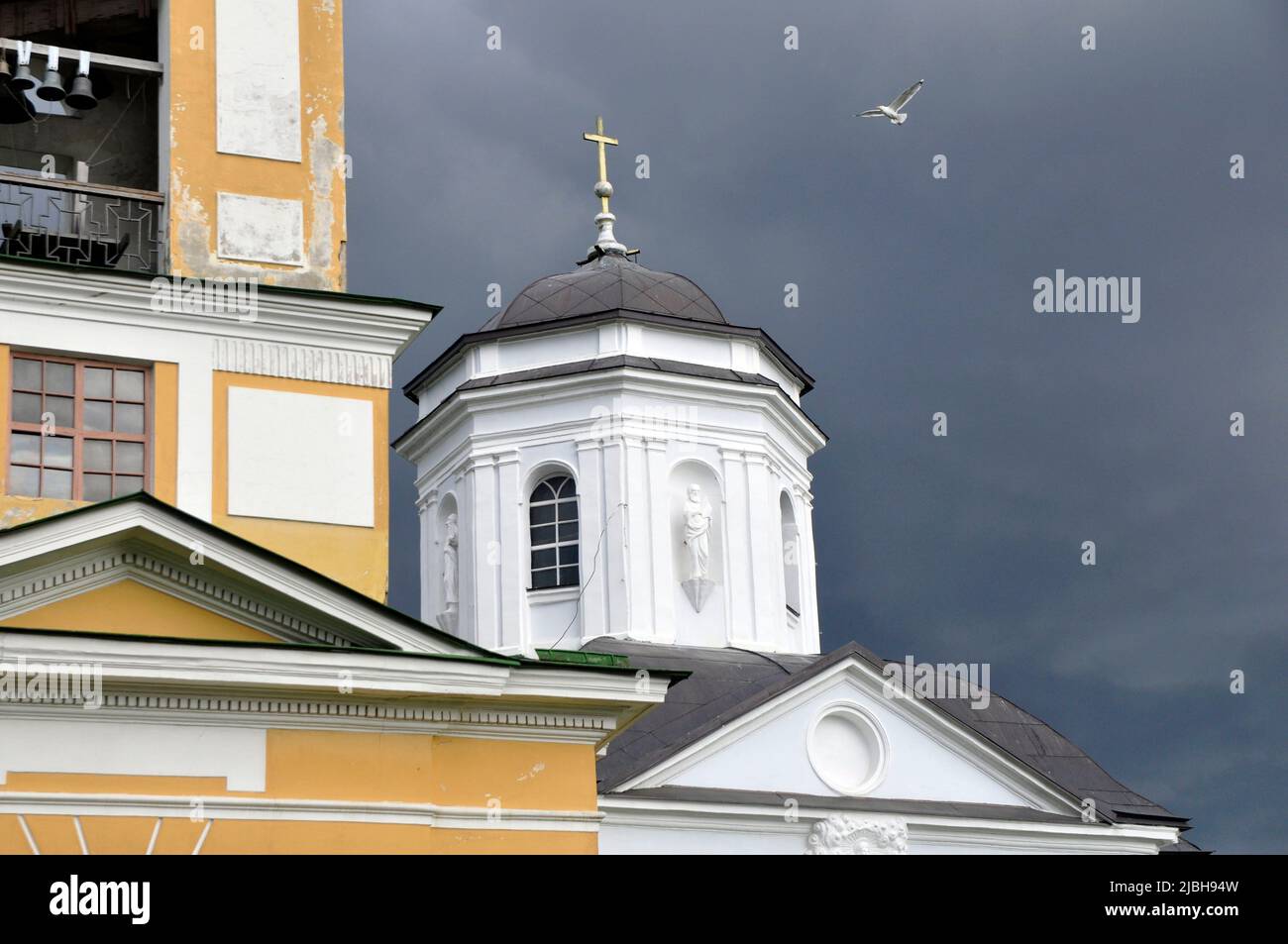 Domes of Russian churches against the backdrop of a dramatic stormy sky ...