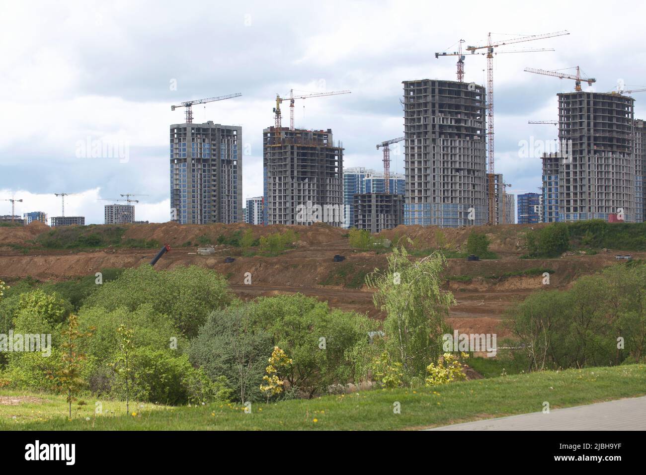 Tower crane on the construction of a building with a frame of ...