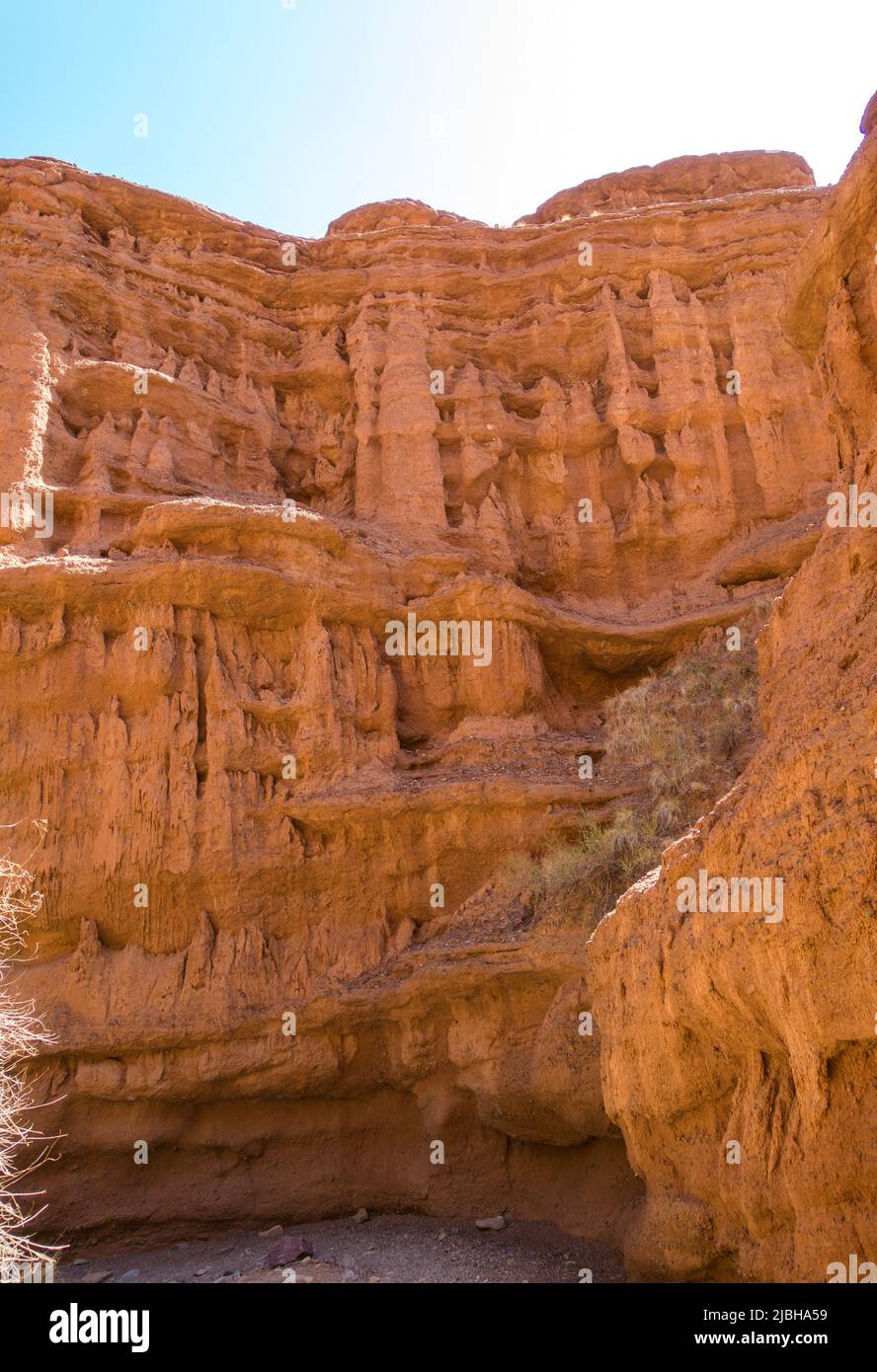 Red rocks and a passage between rocks. Clay canyons. Issyk-Kul region ...