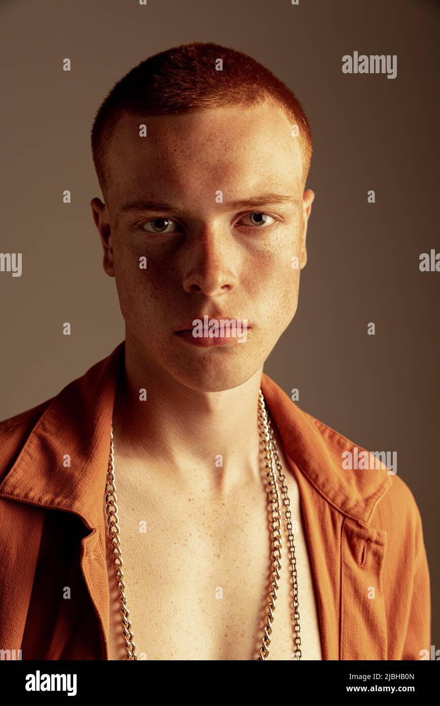 Close-up portrait of handsome red-haired young man with freckled face ...