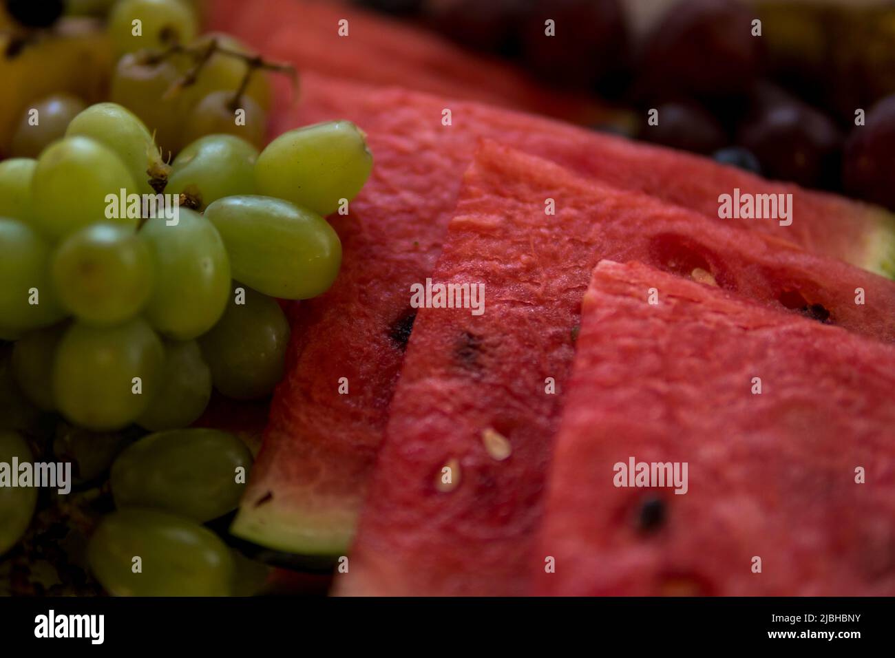 green grapes next to fresh watermelon Stock Photo - Alamy