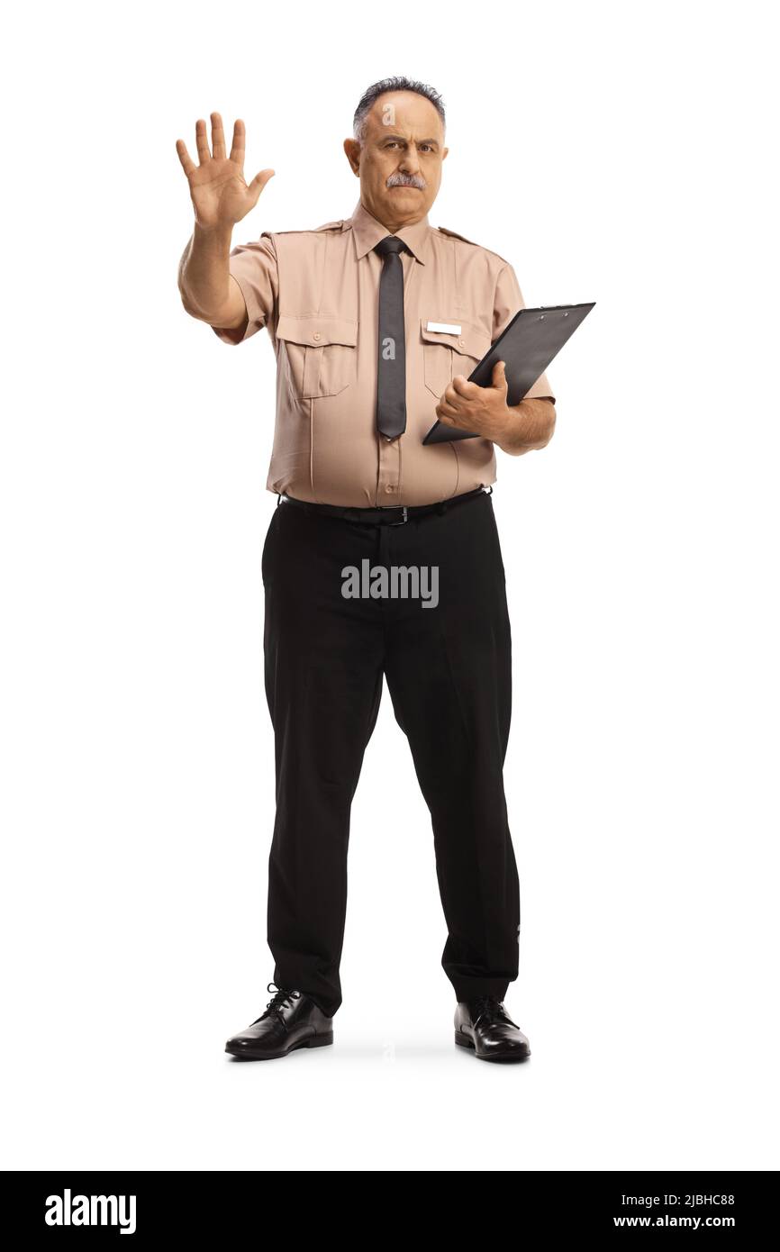 Full length portrait of a serious security officer gesturing stop with ...