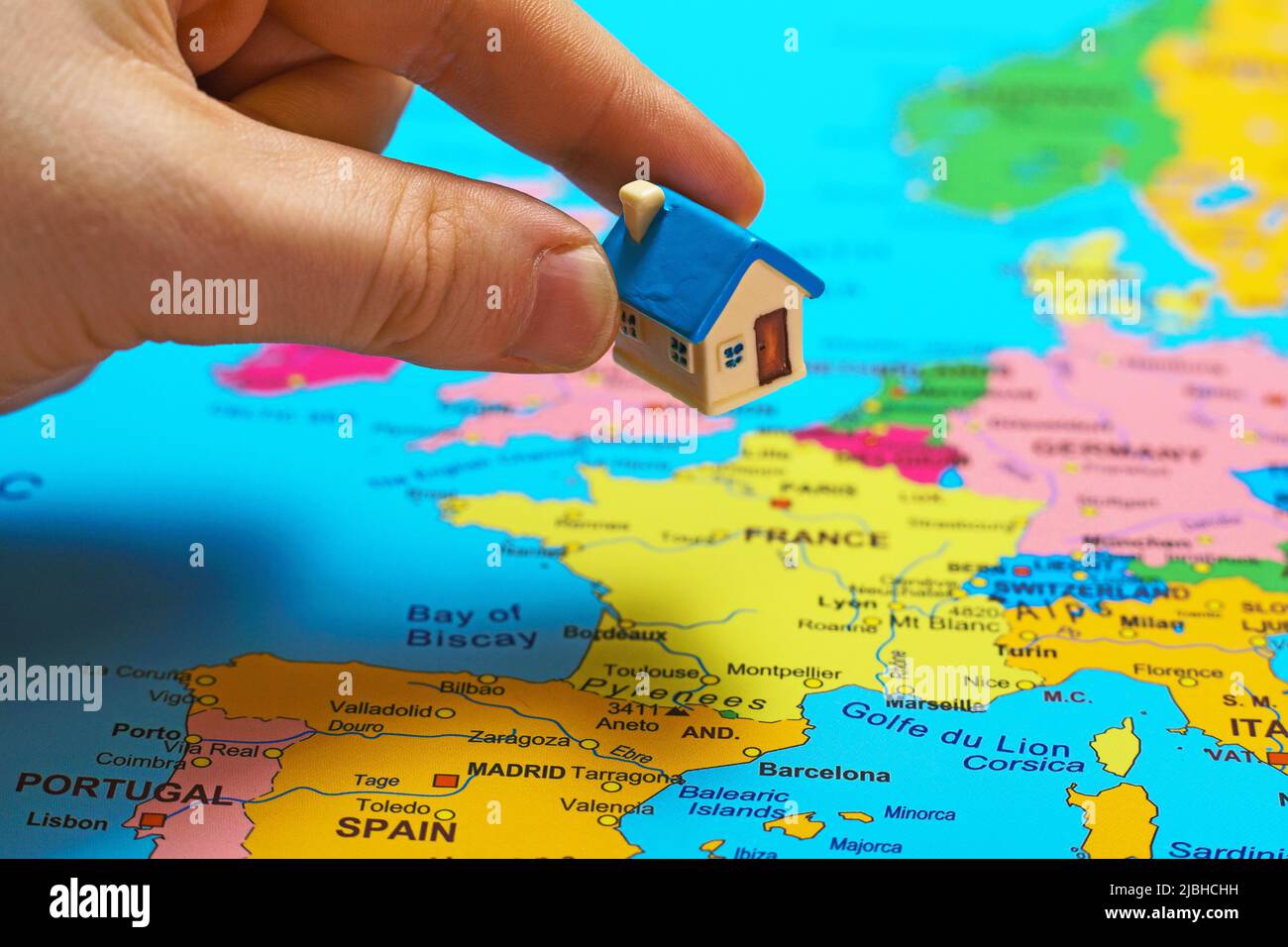 Small toy house on the map of France Stock Photo - Alamy