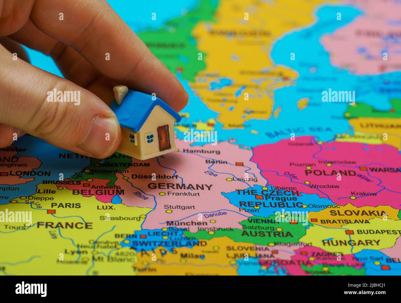 Small toy house on the map of Germany Stock Photo - Alamy