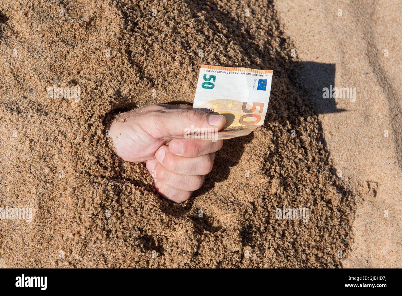 Arm sticking out of sand hi-res stock photography and images - Alamy