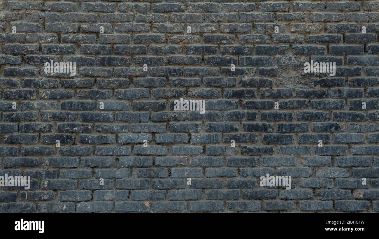 Horizontal part of dark brick wall background. Exterior wide old stone ...