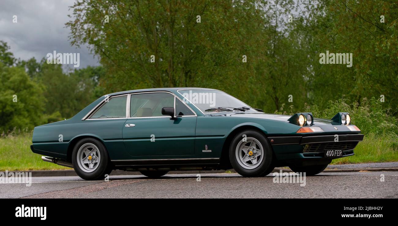 1978 FERRARI 400 with pop up headlights driving in the rain Stock Photo ...