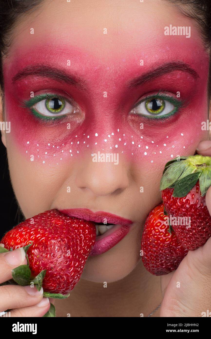 Strawberry woman fantasy makeup portrait Stock Photo - Alamy