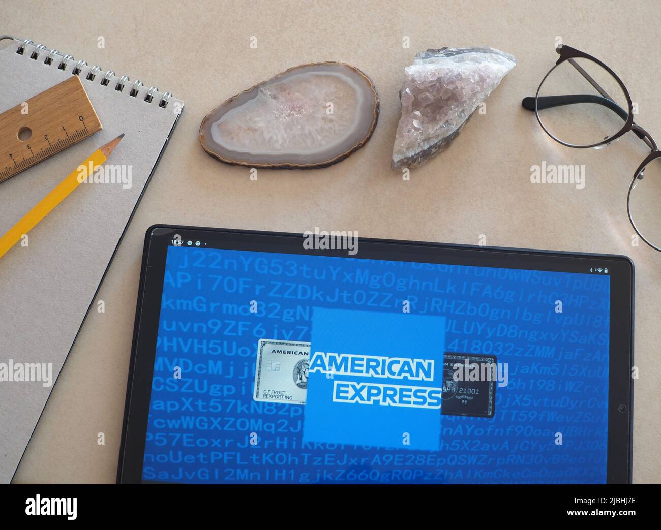 In this photo illustration American Express Company logo seen displayed ...
