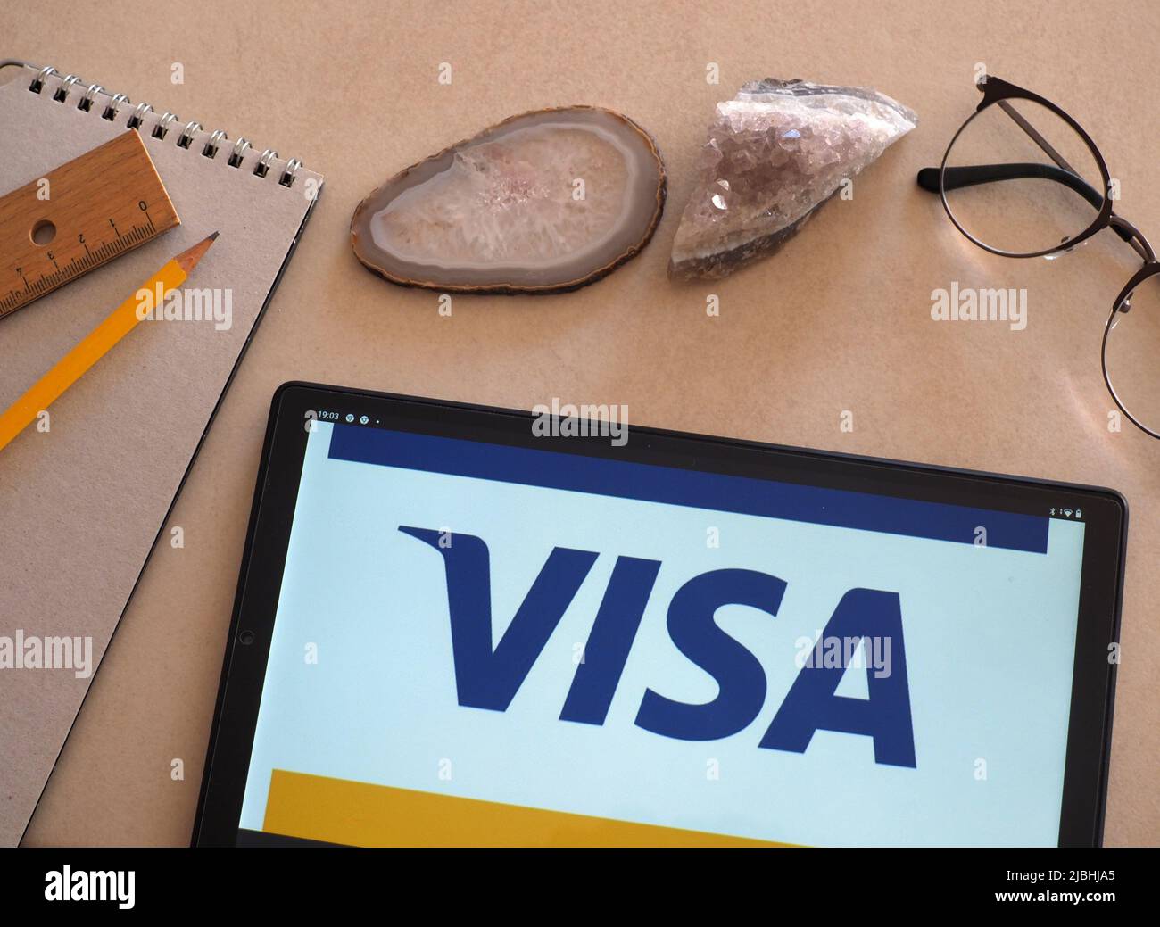 In this photo illustration Visa Inc. logo seen displayed on a tablet Stock Photo - Alamy