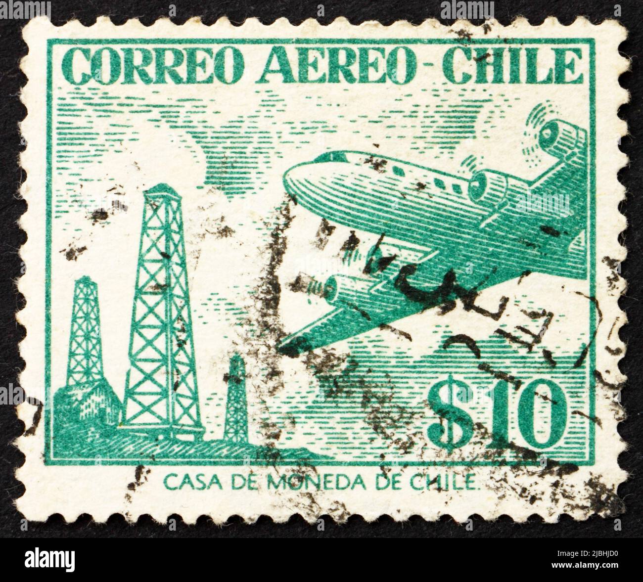CHILE - CIRCA 1956: a stamp printed in the Chile shows Oil Derricks and ...
