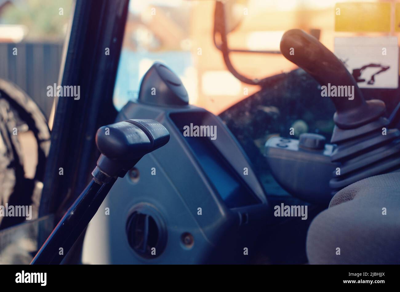 Excavator cabin and controls Stock Photo - Alamy