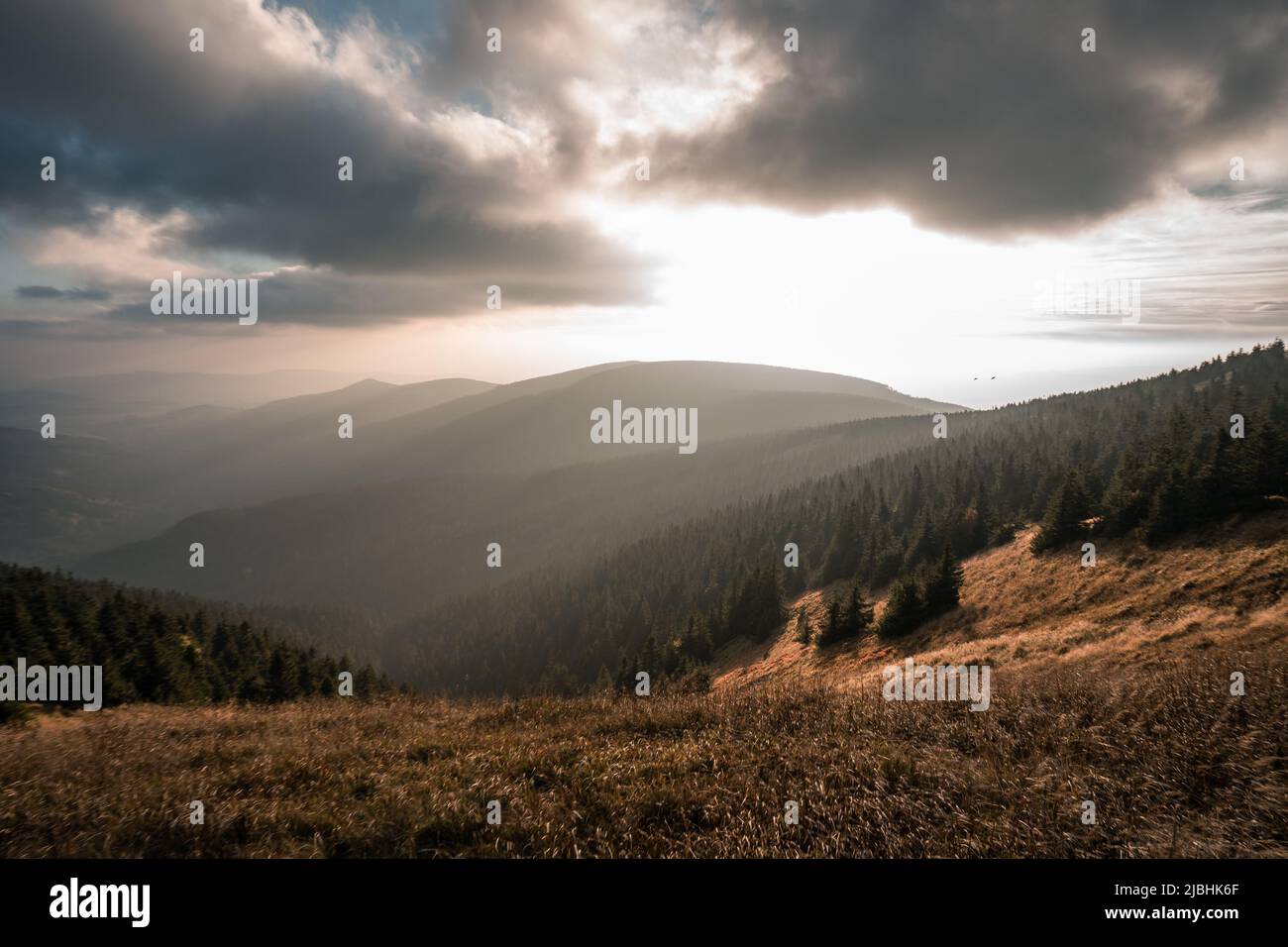 Landscape of warm light sun rays on sky through the clouds over the ...