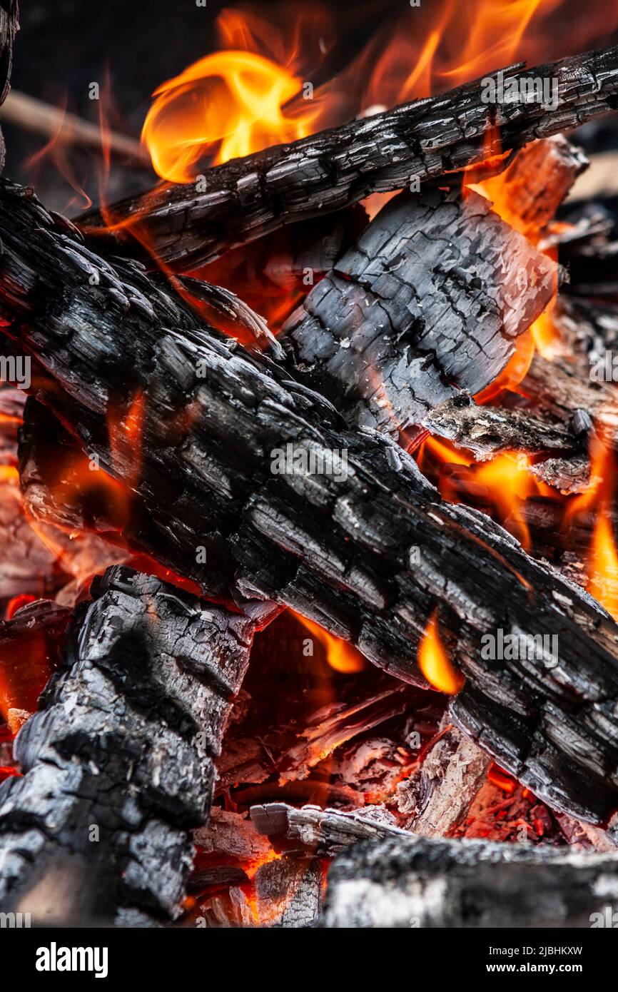 Closeup of charred wood in a low burning camp fire Stock Photo - Alamy