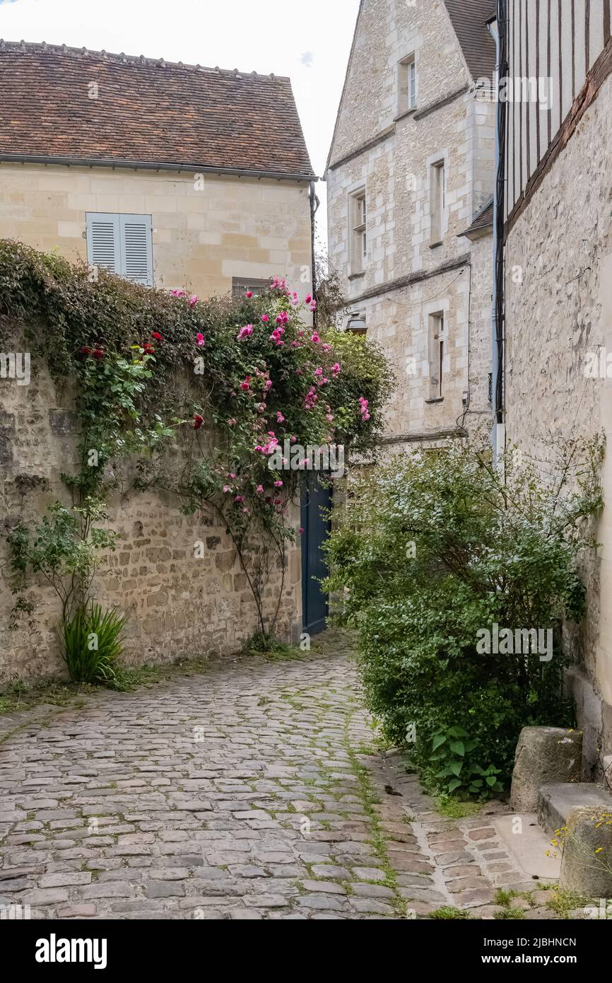Senlis, medieval city in France, typical street with ancient houses ...
