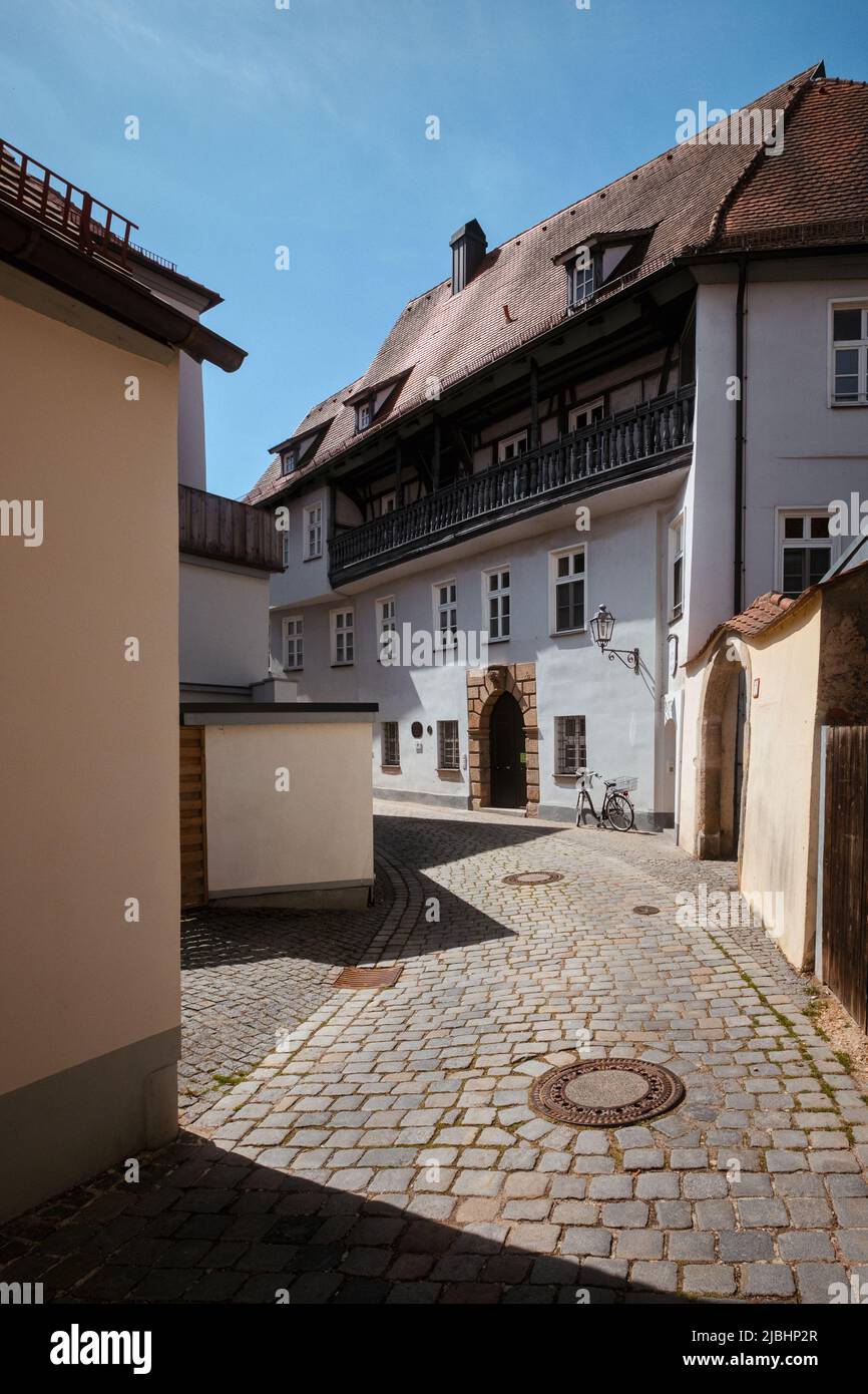 View in the old town of Ansbach and a bicycle leaning against the wall ...