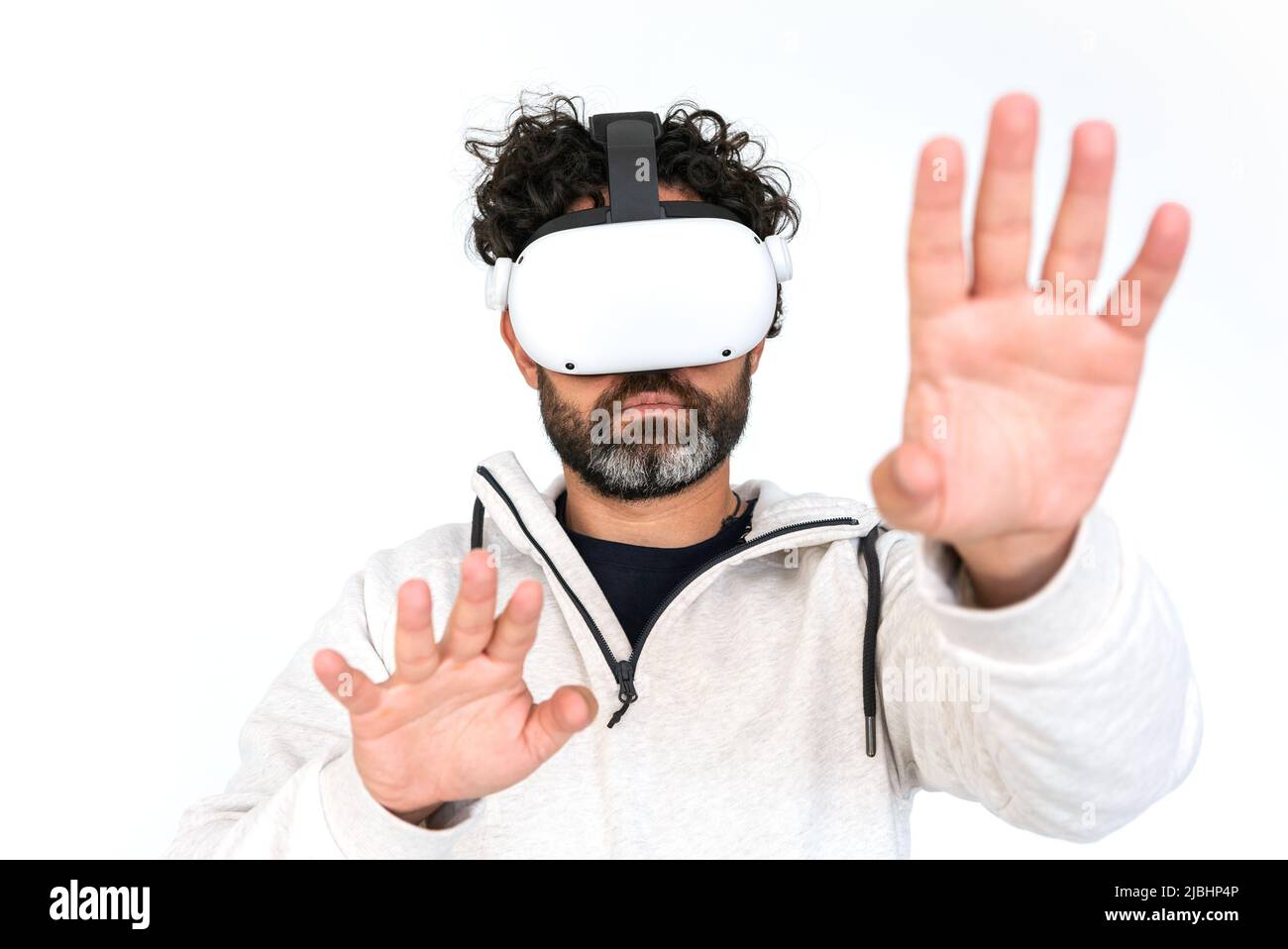 Bearded man watching 360 virtual reality vision on white background ...