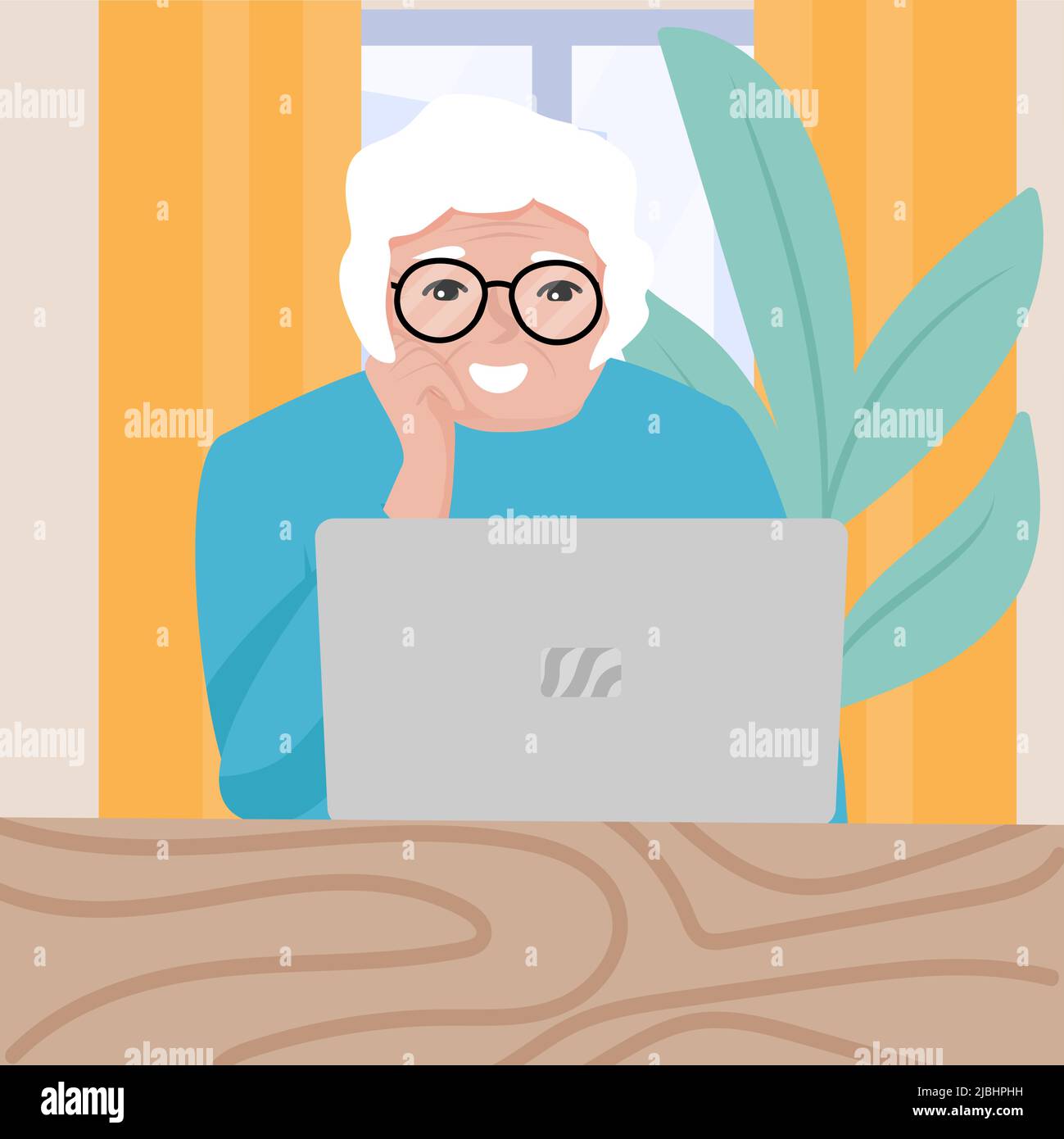 Elderly woman working on laptop sitting near the window. Old person ...