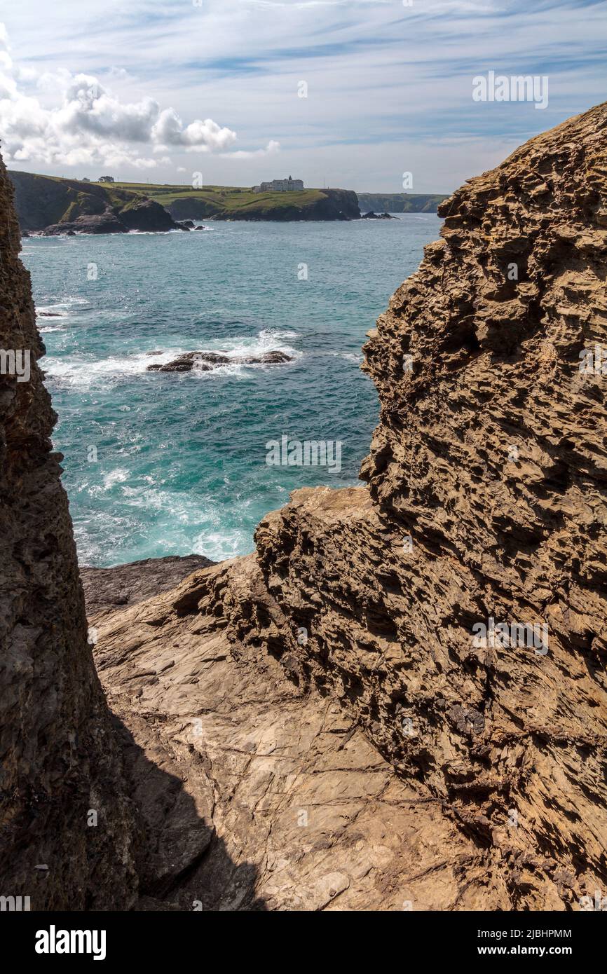 What appears to be a man made path cut through the cliff rock on the ...
