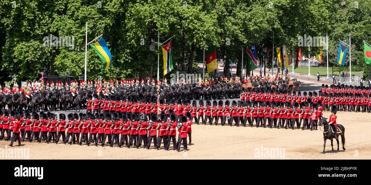 Uniformed guardsmen and women in black and red marching at Horseguards ...