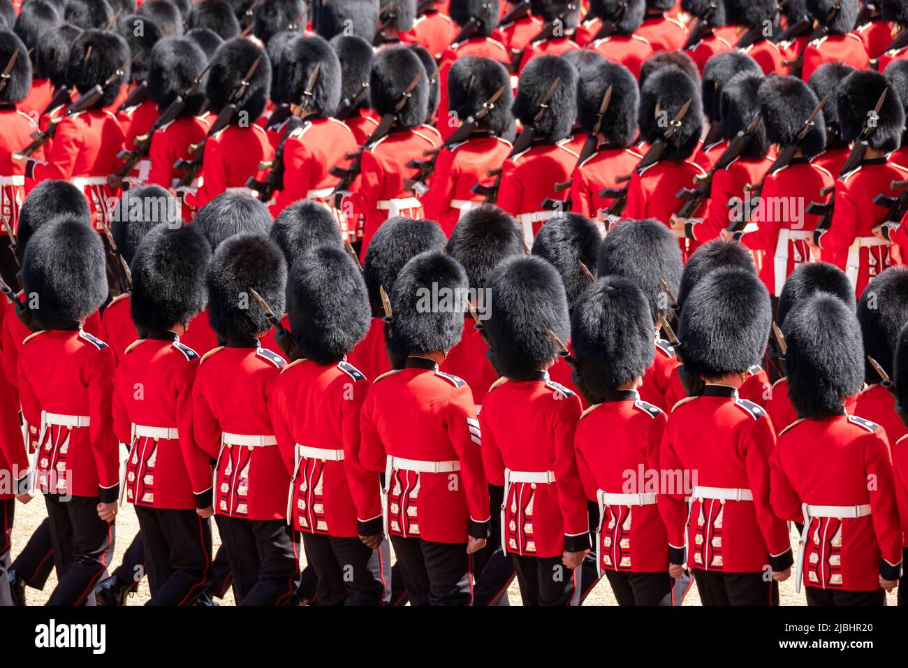 Uniformed guardsmen and women in black and red marching at Horseguards ...