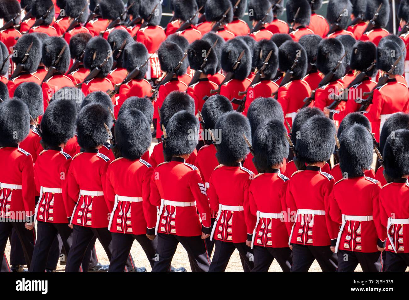 Uniformed guardsmen and women in black and red marching at Horseguards ...