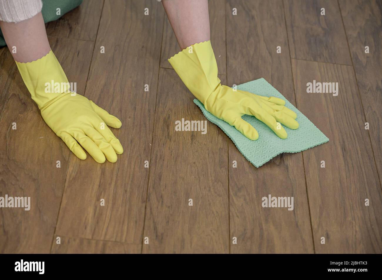 woman's hands wash the floor with a rag with detergents. House cleaning ...