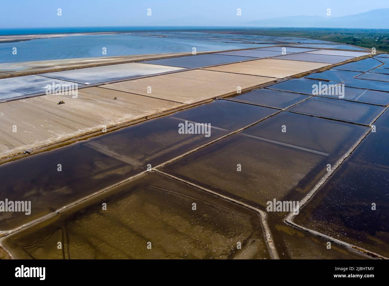 Aerial view of salt evaporation ponds and salt mounds these ponds are ...