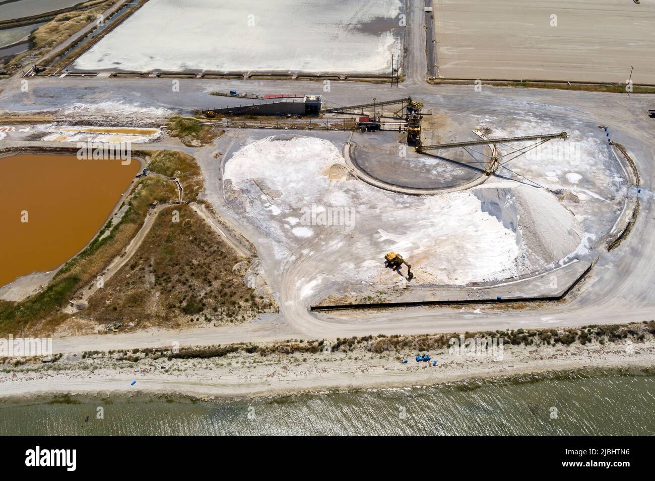 Aerial view of salt evaporation ponds and salt mounds these ponds are ...