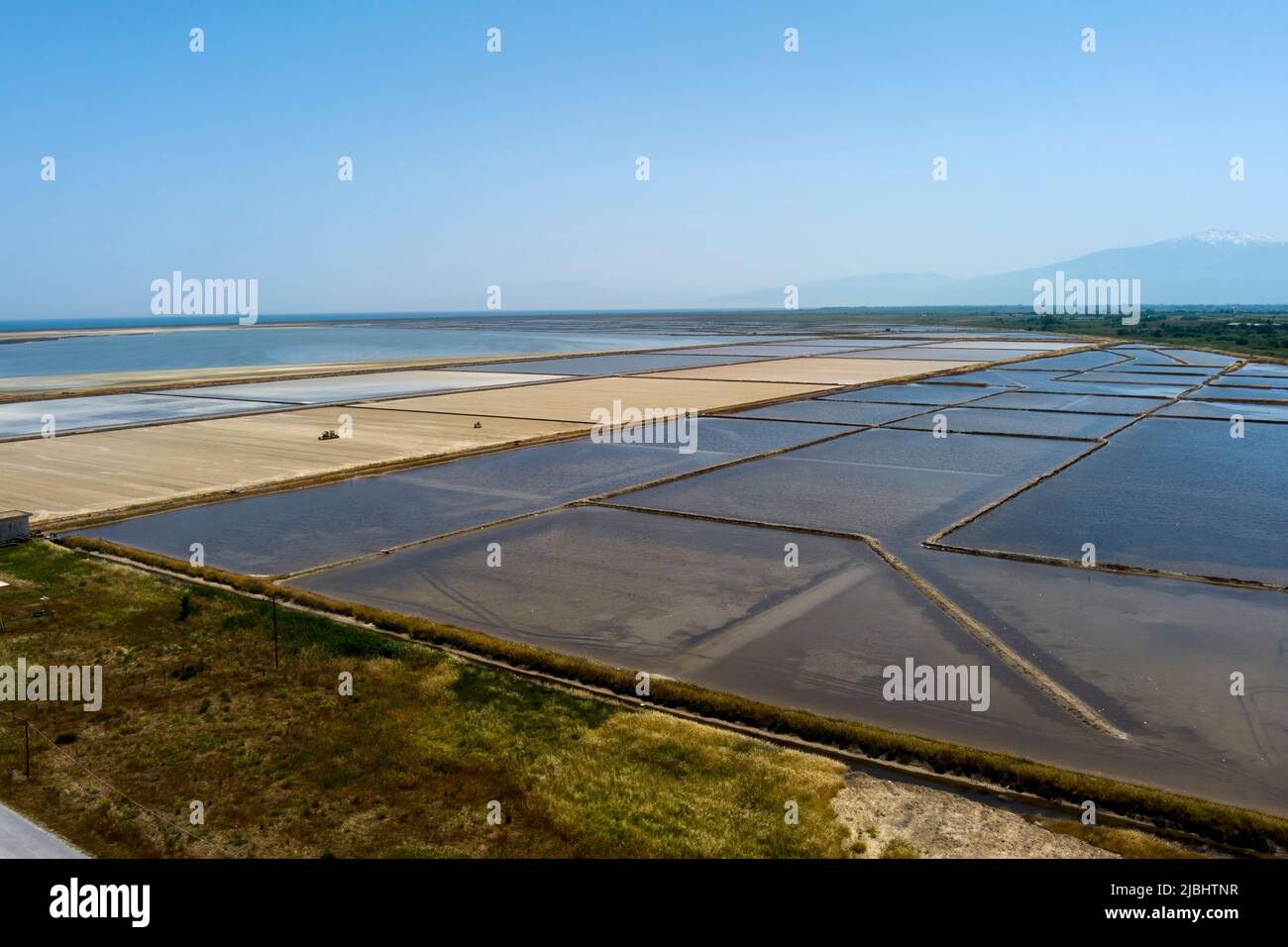 Aerial view of salt evaporation ponds and salt mounds these ponds are ...