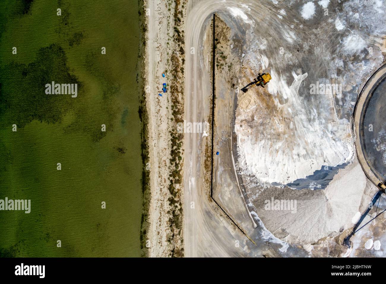 Aerial view of salt evaporation ponds and salt mounds these ponds are ...