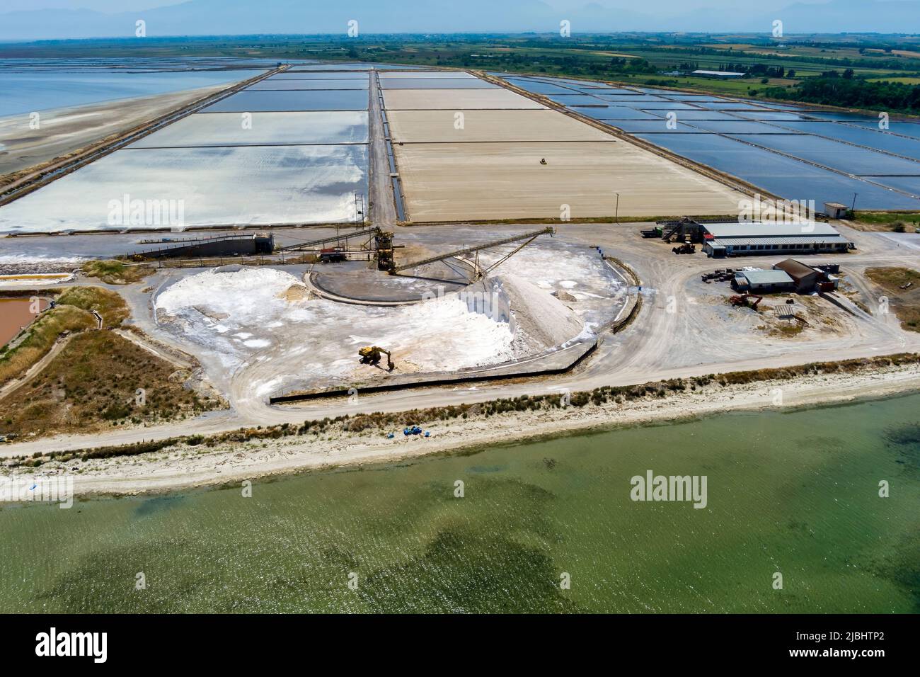 Aerial view of salt evaporation ponds and salt mounds these ponds are ...