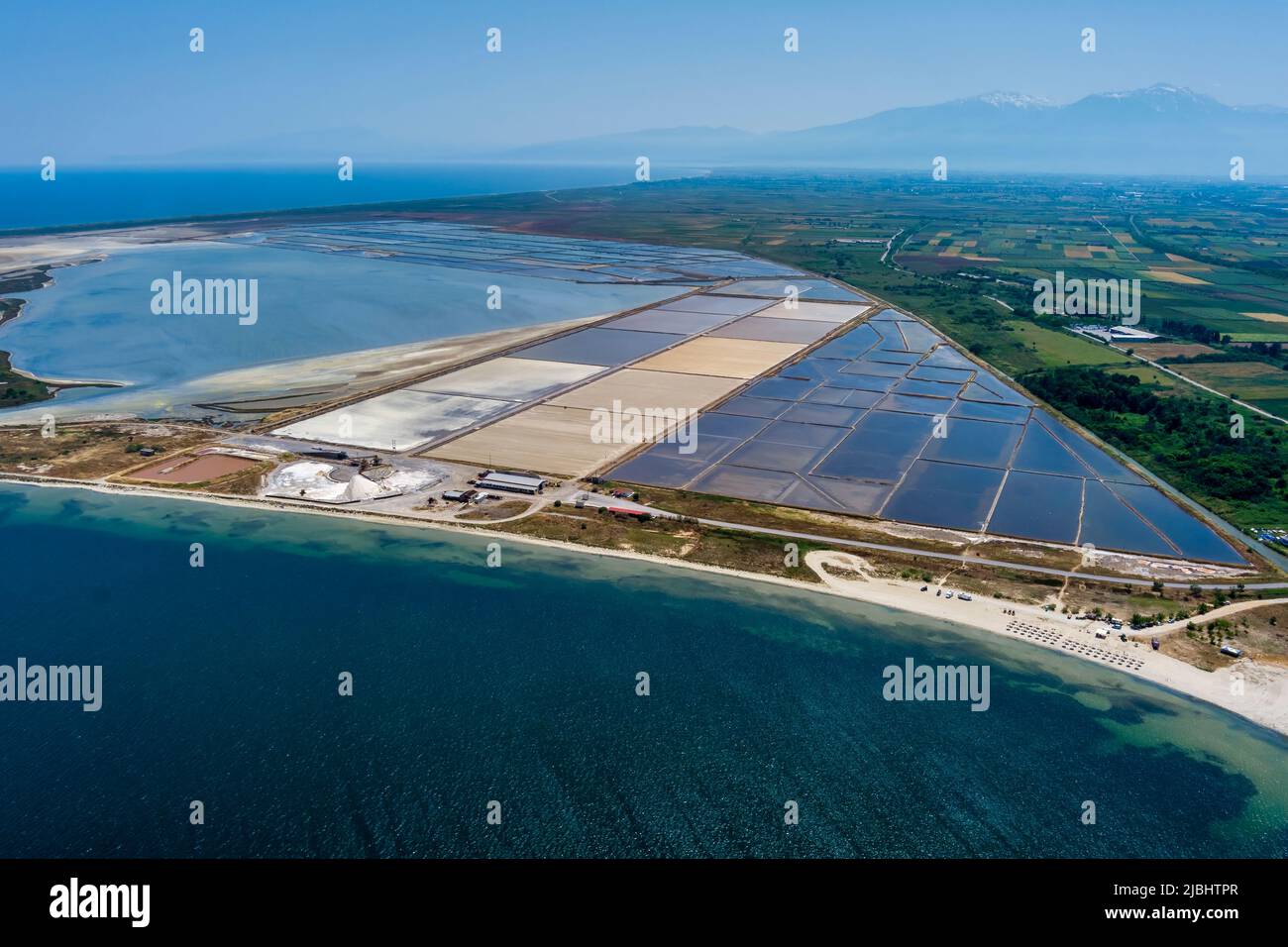 Aerial view of salt evaporation ponds and salt mounds these ponds are ...
