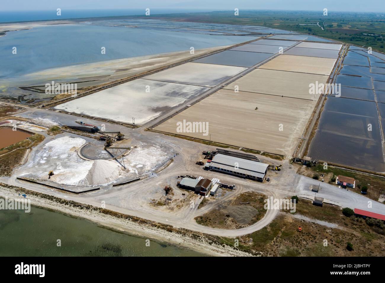 Aerial view of salt evaporation ponds and salt mounds these ponds are ...