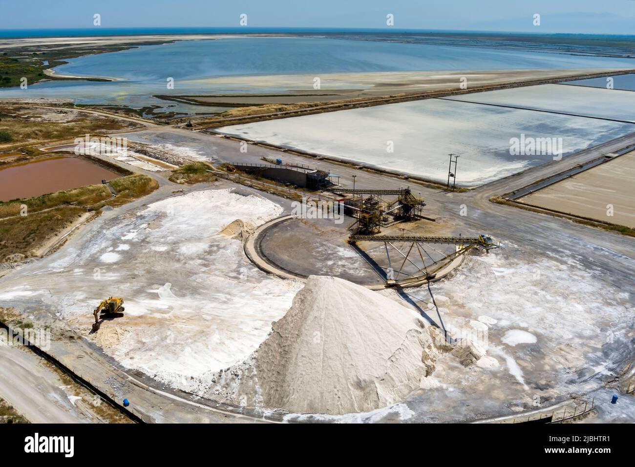 Aerial view of salt evaporation ponds and salt mounds these ponds are ...