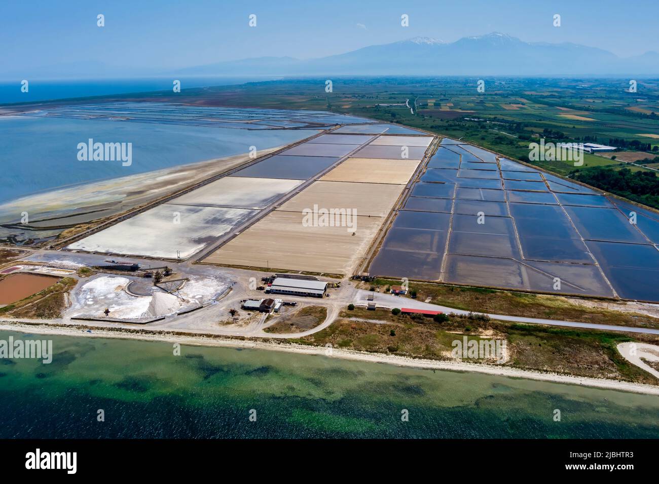Aerial view of salt evaporation ponds and salt mounds these ponds are ...